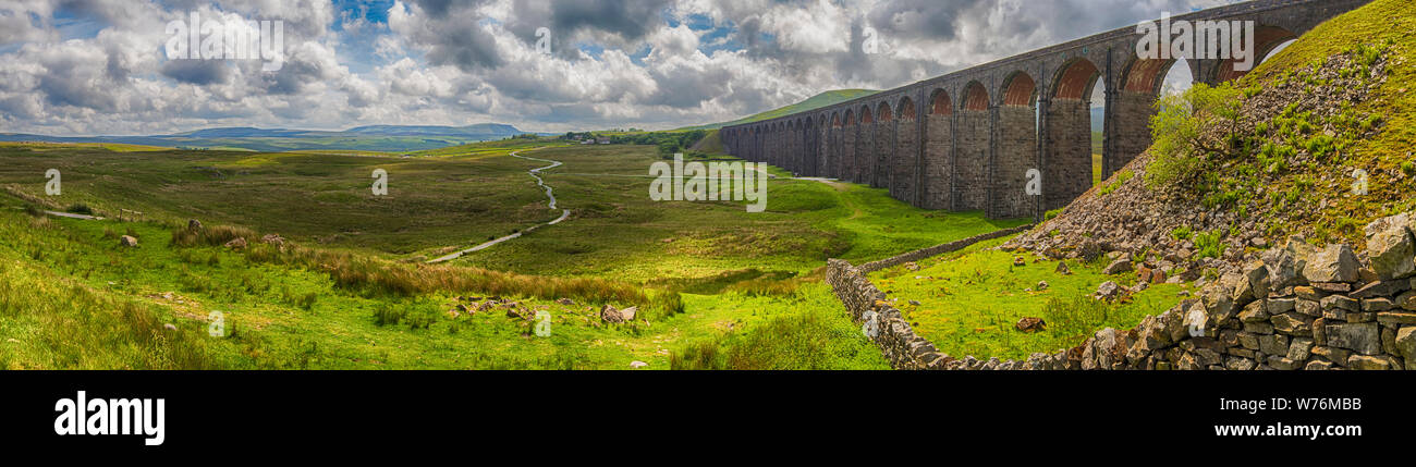 View of a large old Victorian railway viaduct across valley in rural ...
