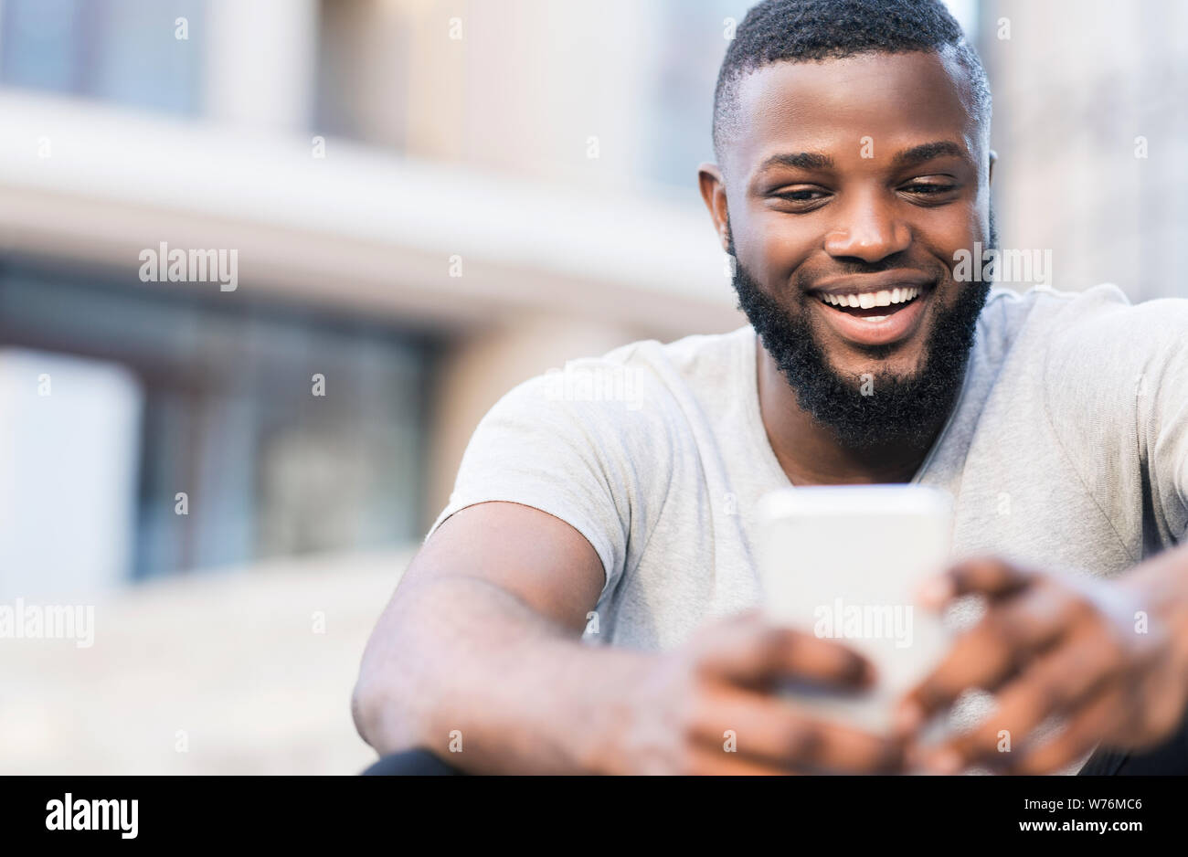 Handsome african man making selfie and smiling outdoor Stock Photo - Alamy