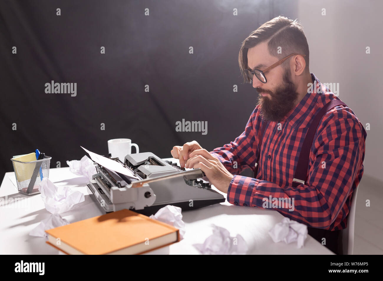 people, writer and hipster concept - young stylish writer working on ...