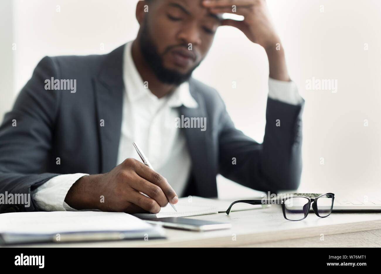 Serious african american writing desk hi-res stock photography and ...
