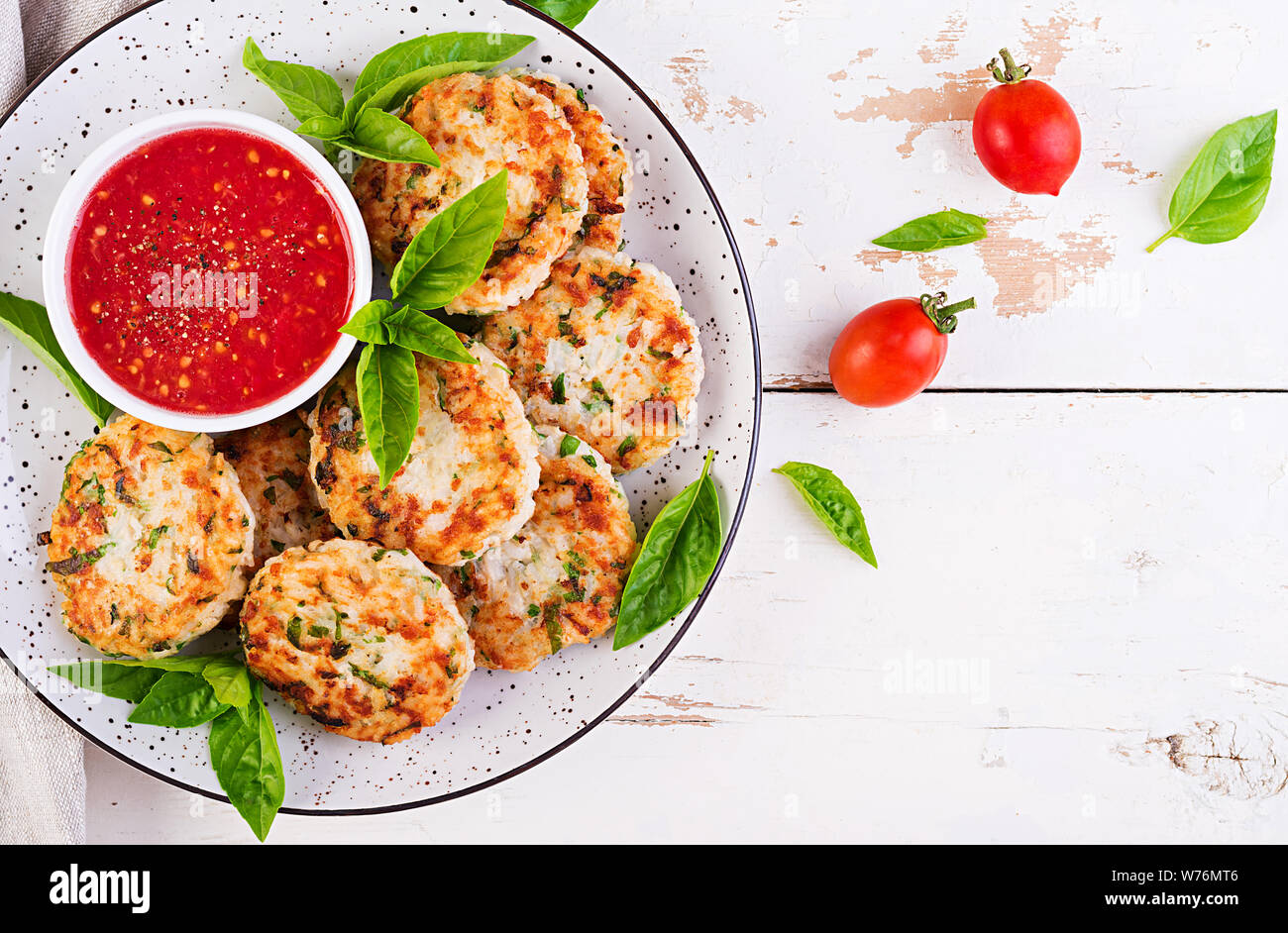 Delicious rice and chicken meat patties with garlic tomato sauce. Top ...