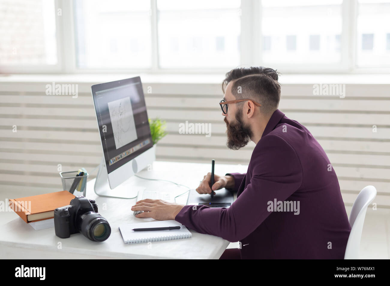 people, design and style concept - graphic designer sketching new ...