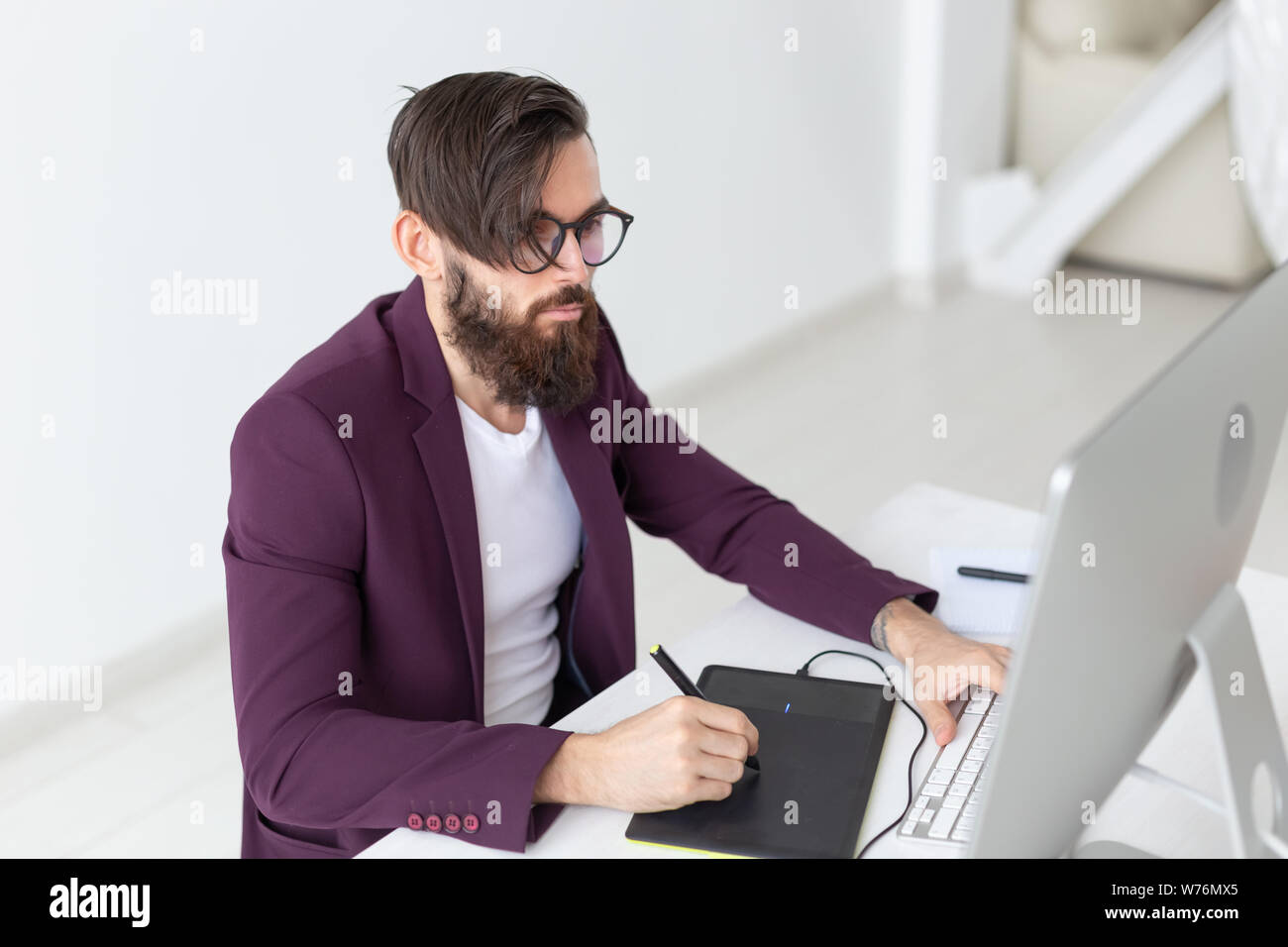 People and technology concept - Attractive man with beard, dressed in ...