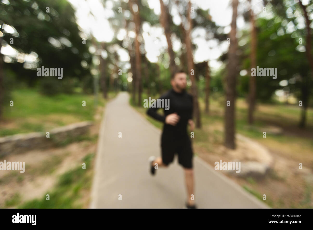 Man running track blurred motion hi-res stock photography and images ...