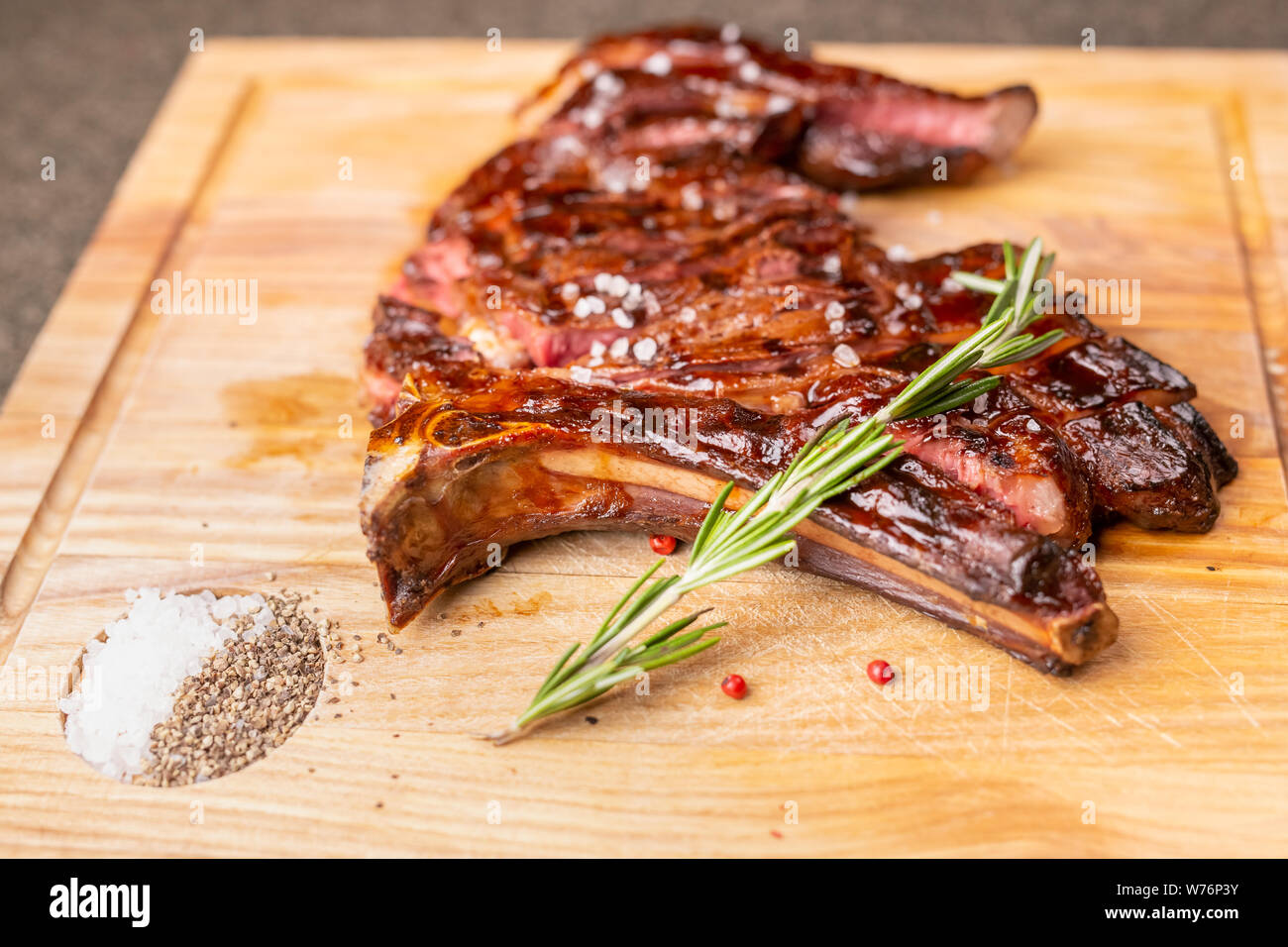 Food and horse meat concept - Roast meat on cutting board with cumin ...