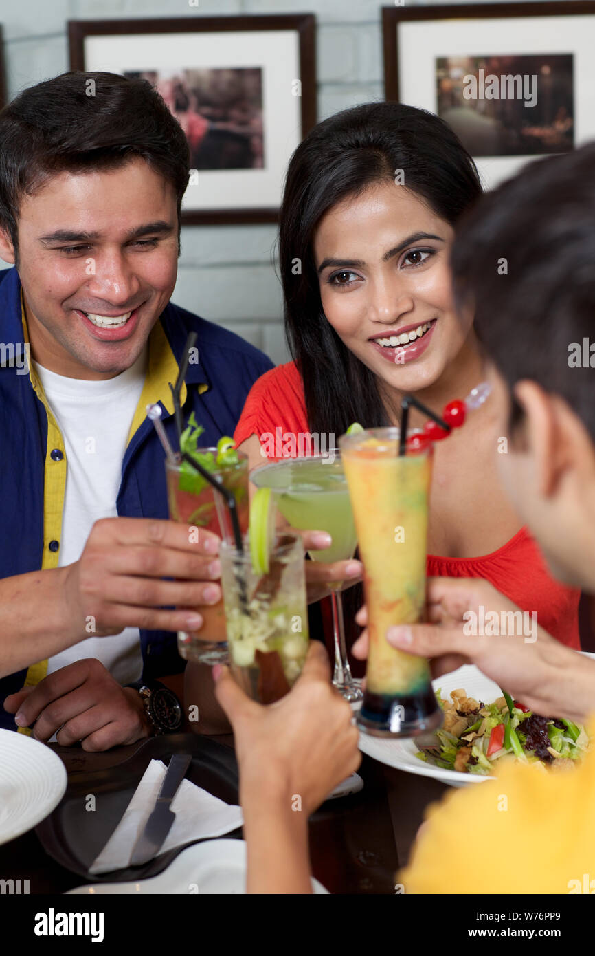 Indian friends having dinner hi-res stock photography and images - Alamy