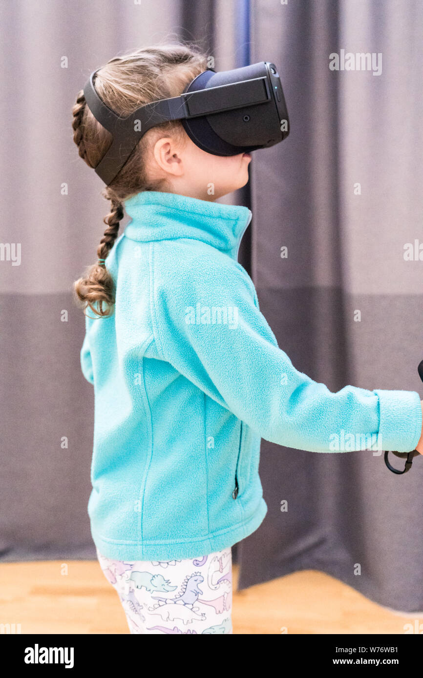 Little girl playing VR kids game in the living room Stock Photo - Alamy