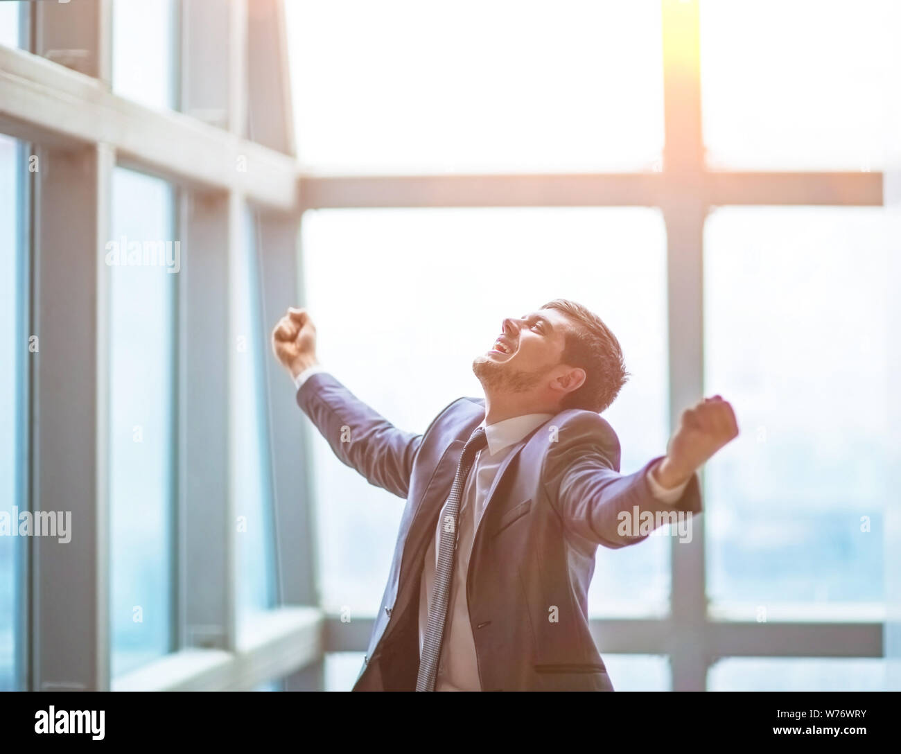 Excited young man celebrates victory hi-res stock photography and ...
