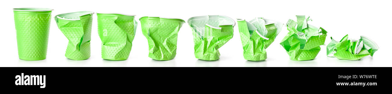 Green crumpled plastic cups isolated on white background Stock Photo ...