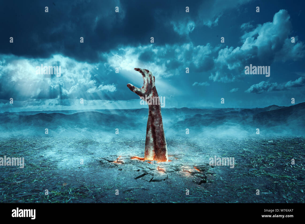Rise of zombies hand from the ground at night with moonlight and dark ...