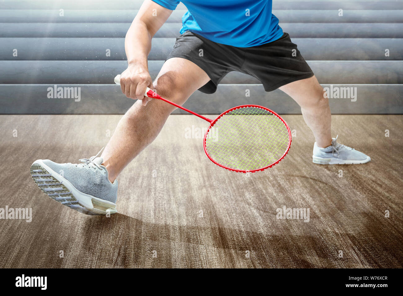 Man playing badminton with badminton racket on the indoor court Stock ...