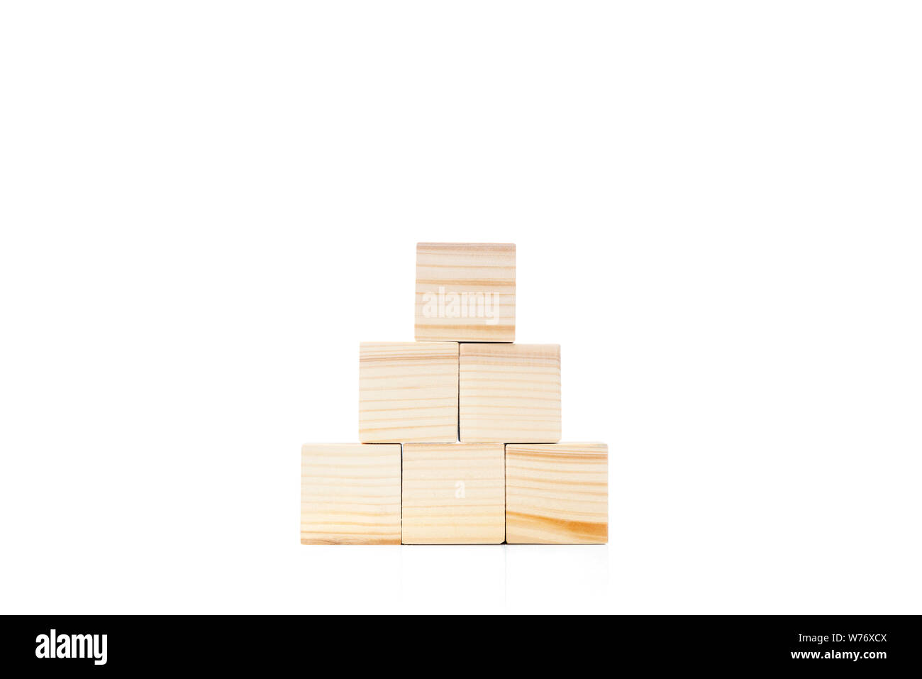 Wooden block toy with a pyramid shape isolated over white background ...
