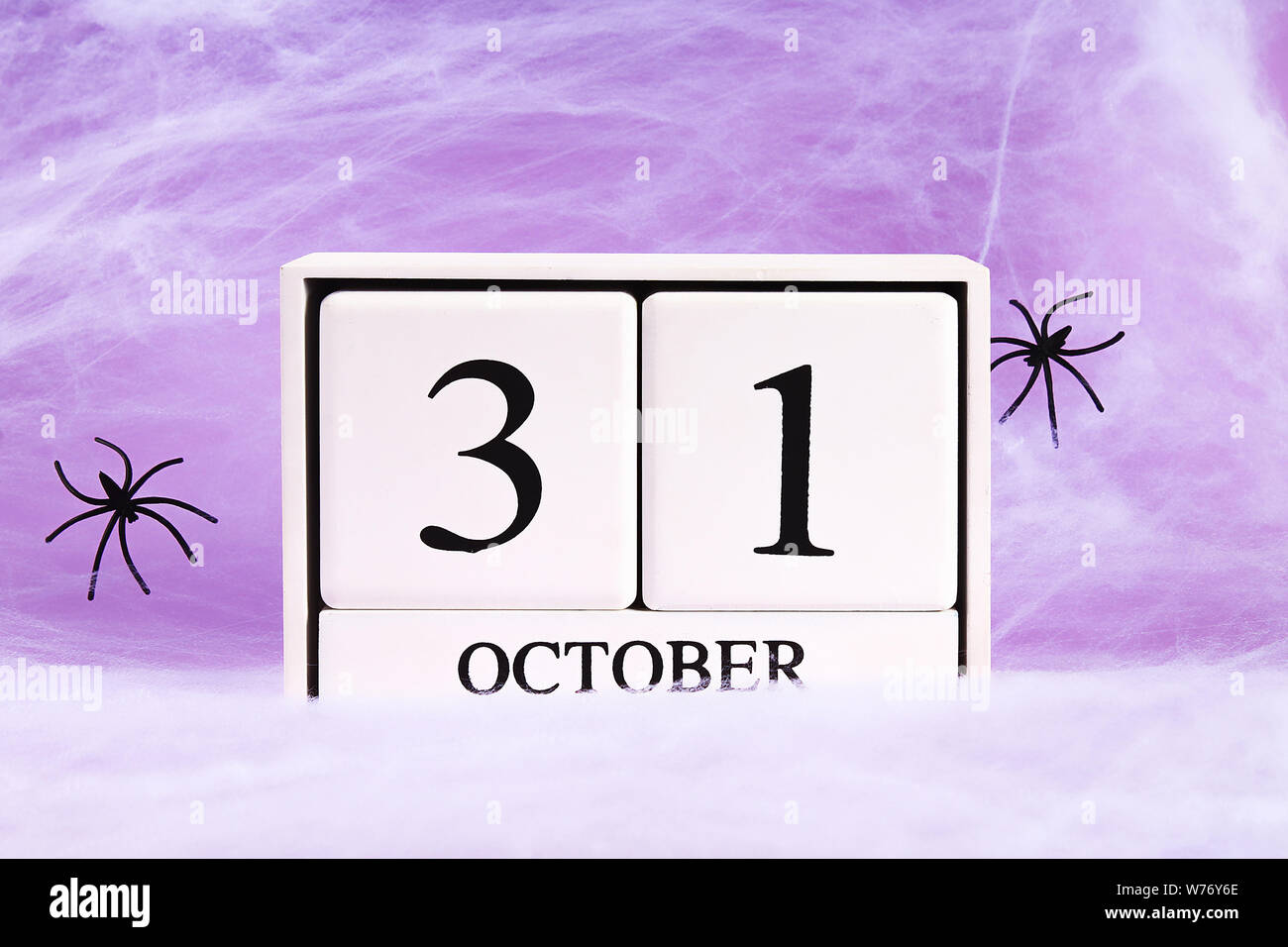 Halloween holiday concept. White spider web with two black spider web ...