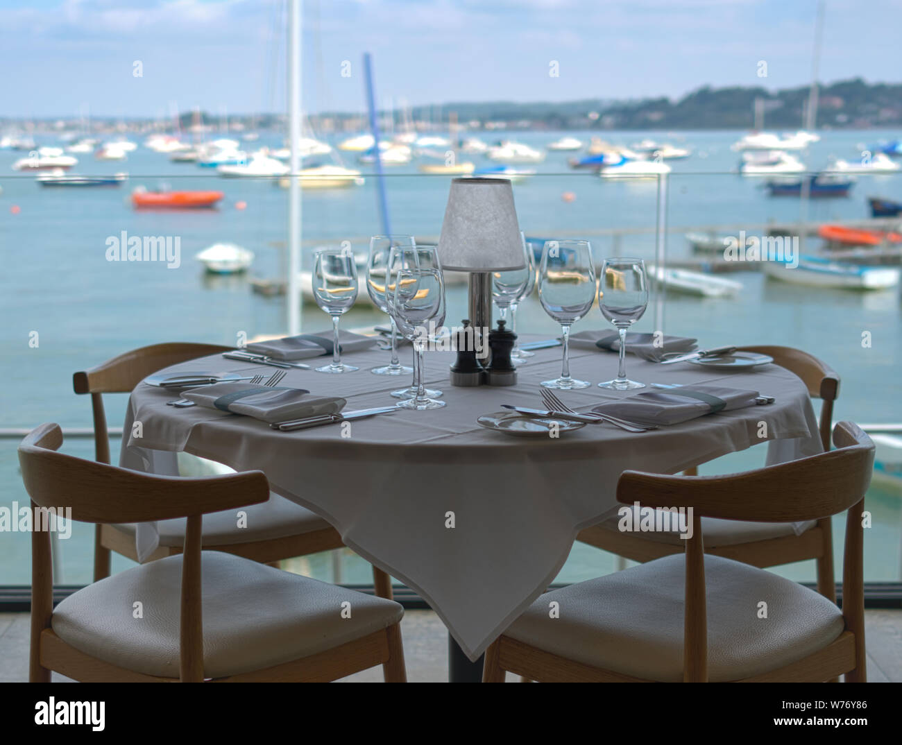 Restaurant table with stunning view over Poole harbour Stock Photo - Alamy