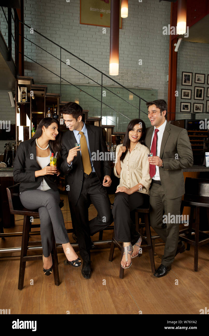Business executives having drinks in a bar Stock Photo - Alamy