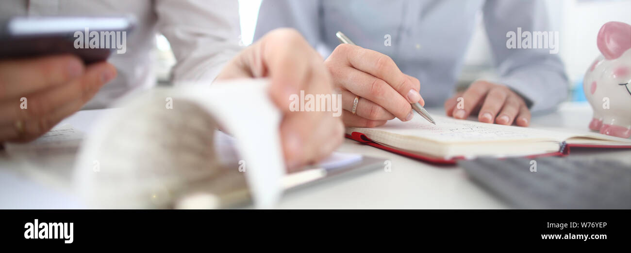Husband and wife check purchases for Stock Photo - Alamy