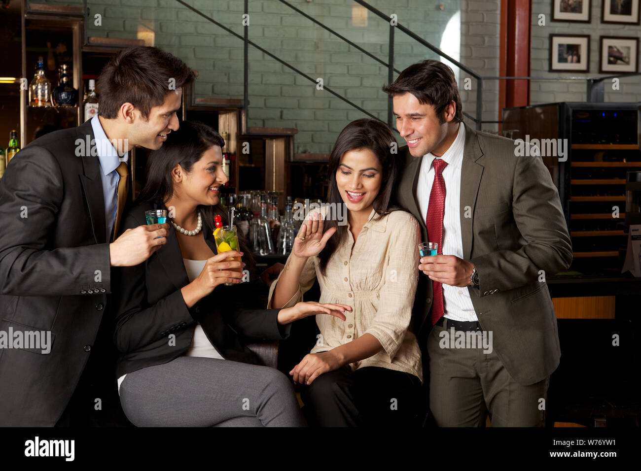 Business executives having drinks in a bar Stock Photo - Alamy
