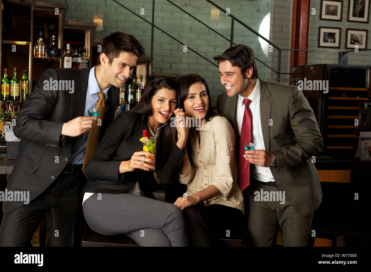 Business executives having drinks in a bar Stock Photo - Alamy