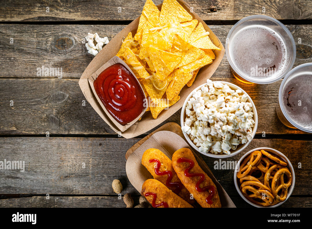 Selection of stadium game foods - nachos, pop corn, pretzels, corn dogs ...