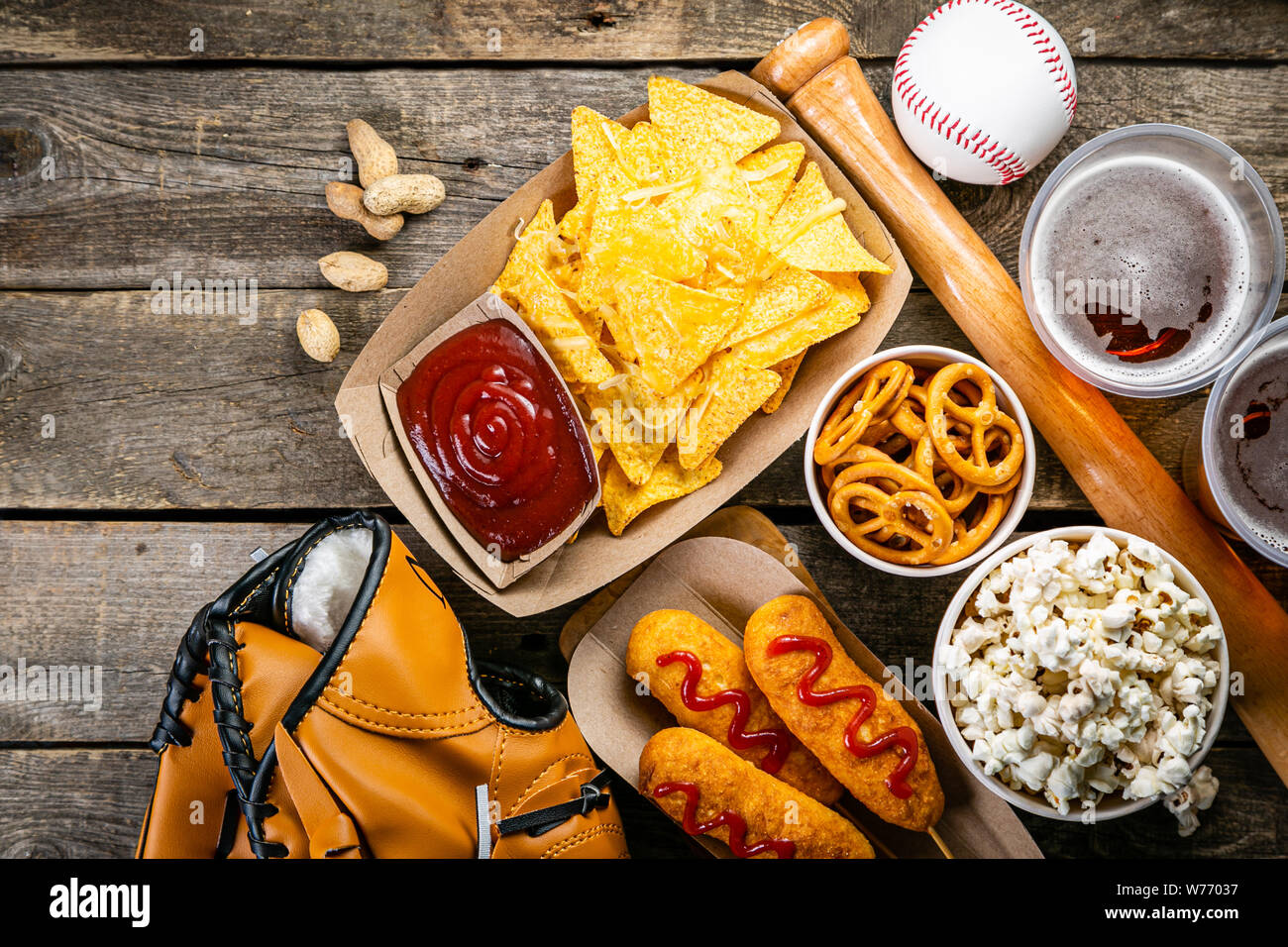 Selection of stadium game foods - nachos, pop corn, pretzels, corn dogs ...