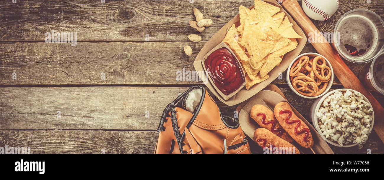 Selection of stadium game foods - nachos, pop corn, pretzels, corn dogs ...