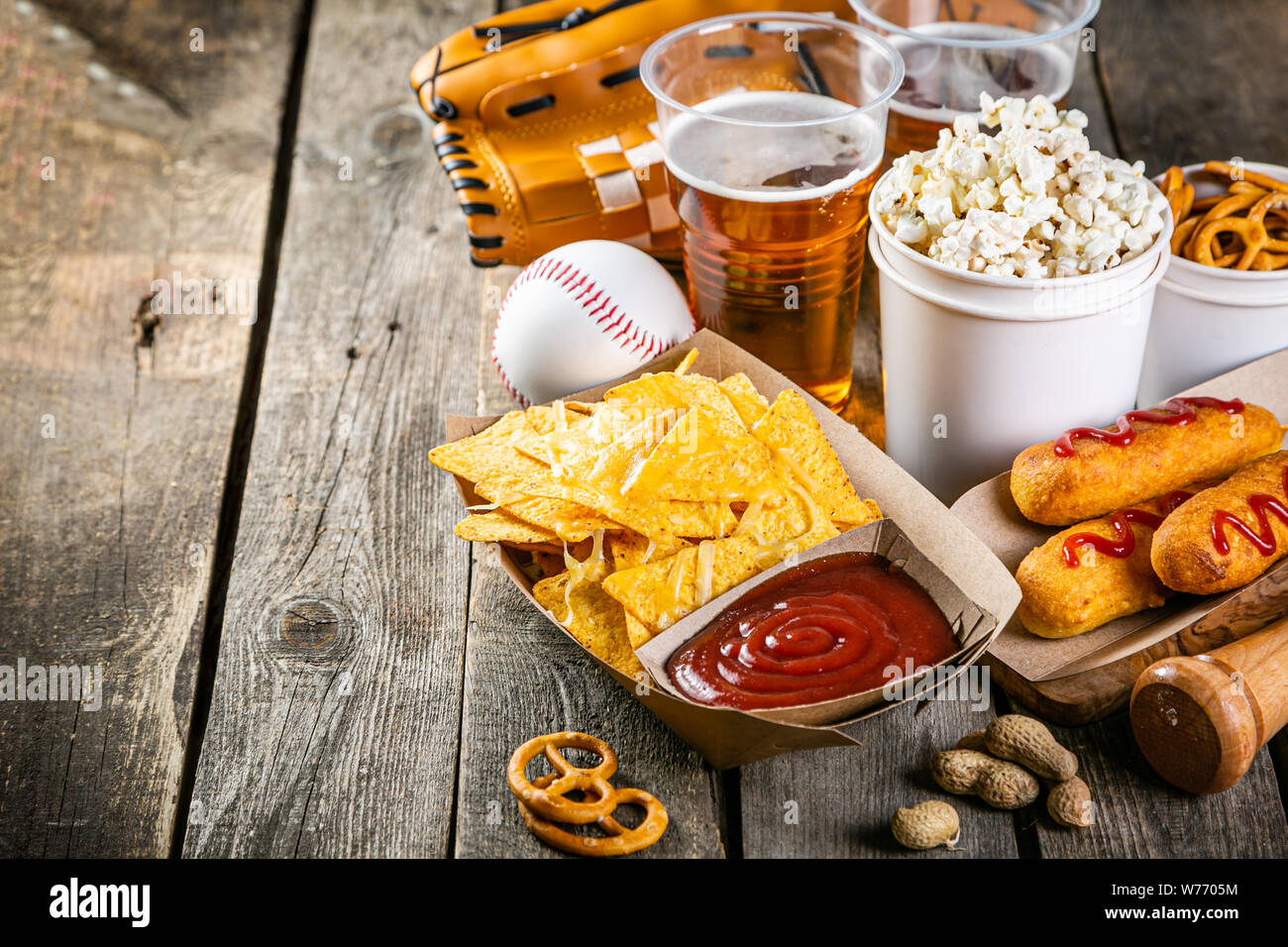 Selection of stadium game foods - nachos, pop corn, pretzels, corn dogs ...