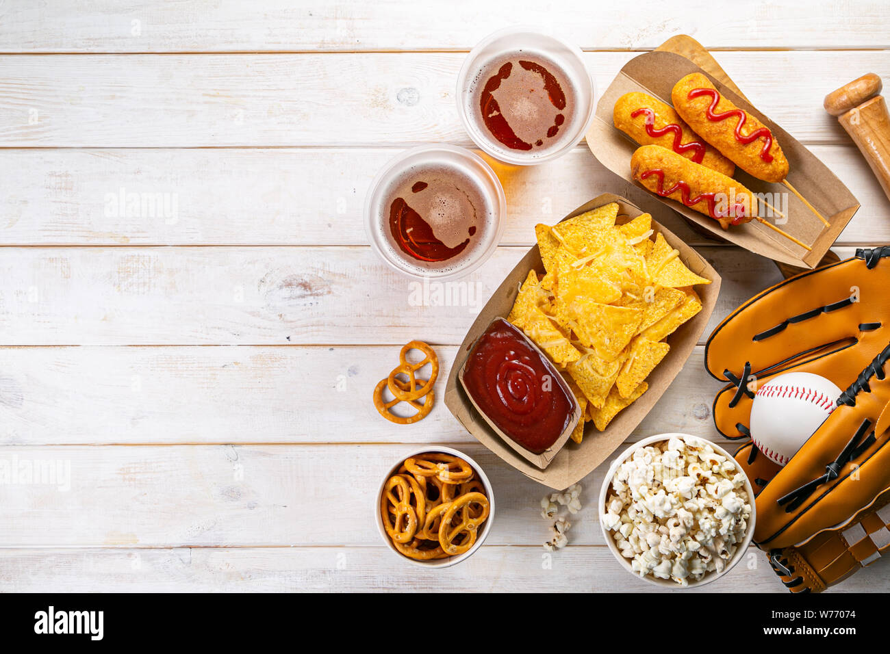 Selection of stadium game foods - nachos, pop corn, pretzels, corn dogs ...