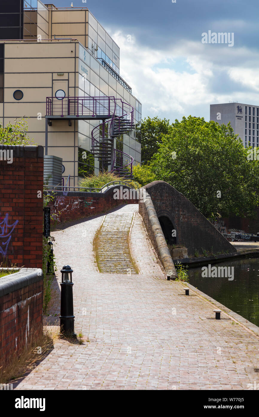 The Digbeth Branch Canal heads south into the city centre, the sunlight ...