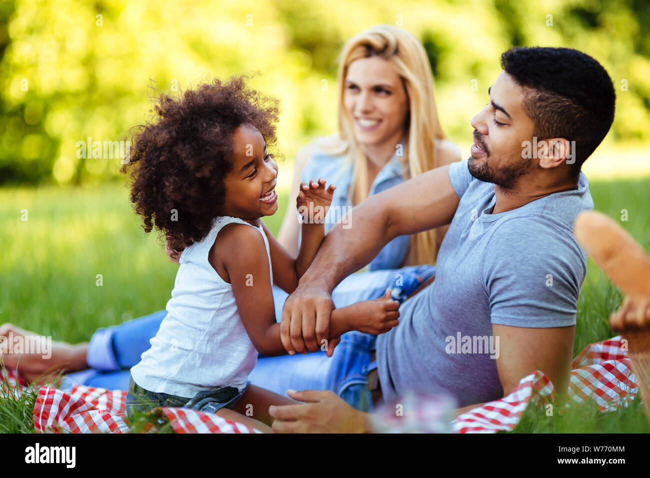 Happy family three playing garden hi-res stock photography and images ...