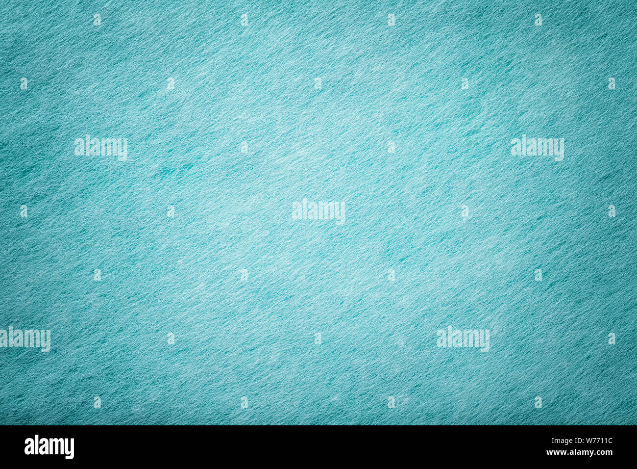 Light turquoise matte background of suede fabric, closeup. Velvet ...
