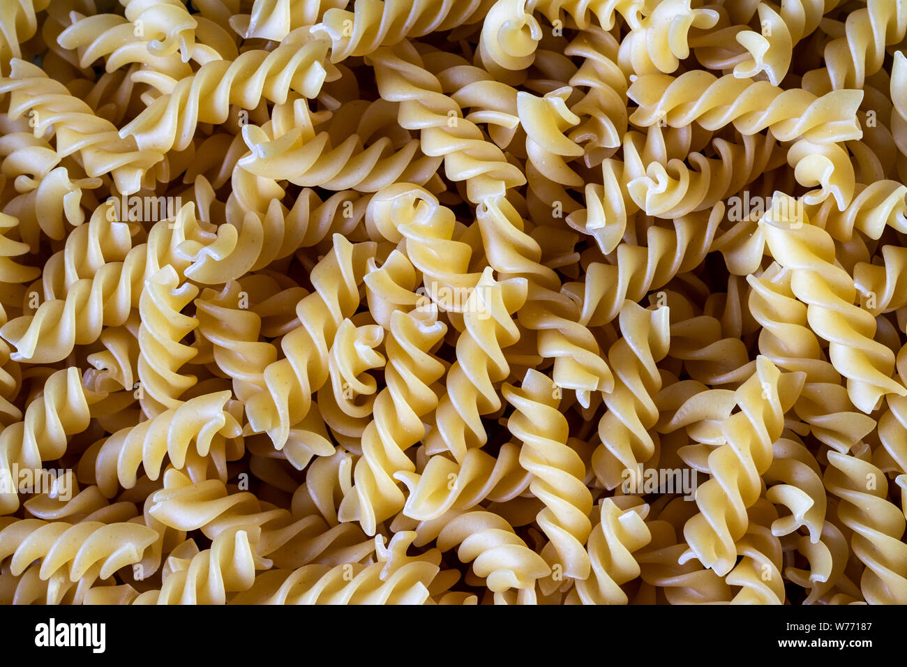 Yellow italian pasta abstract background. Traditional food. Texture ...