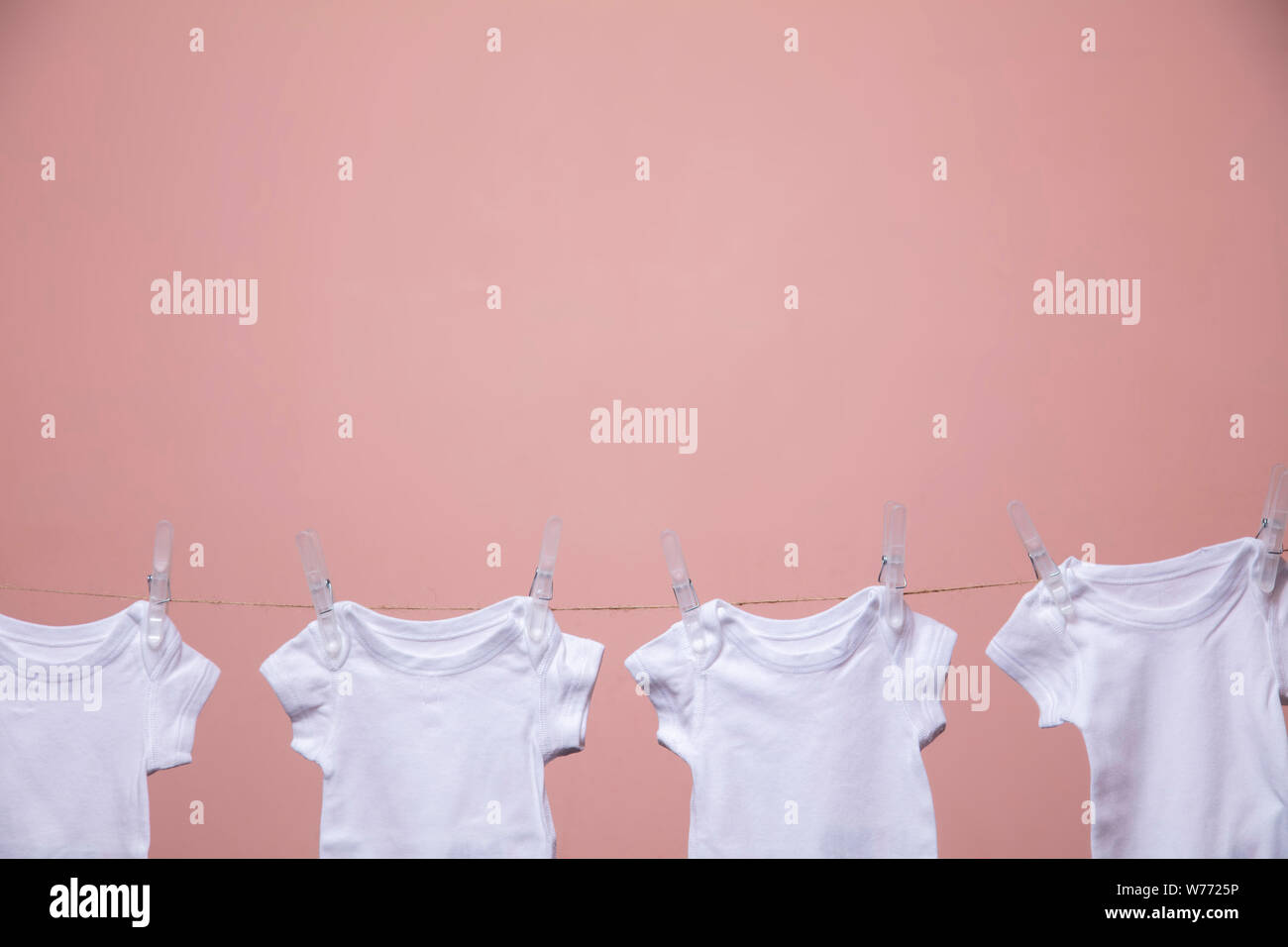 White baby grow hi-res stock photography and images - Alamy