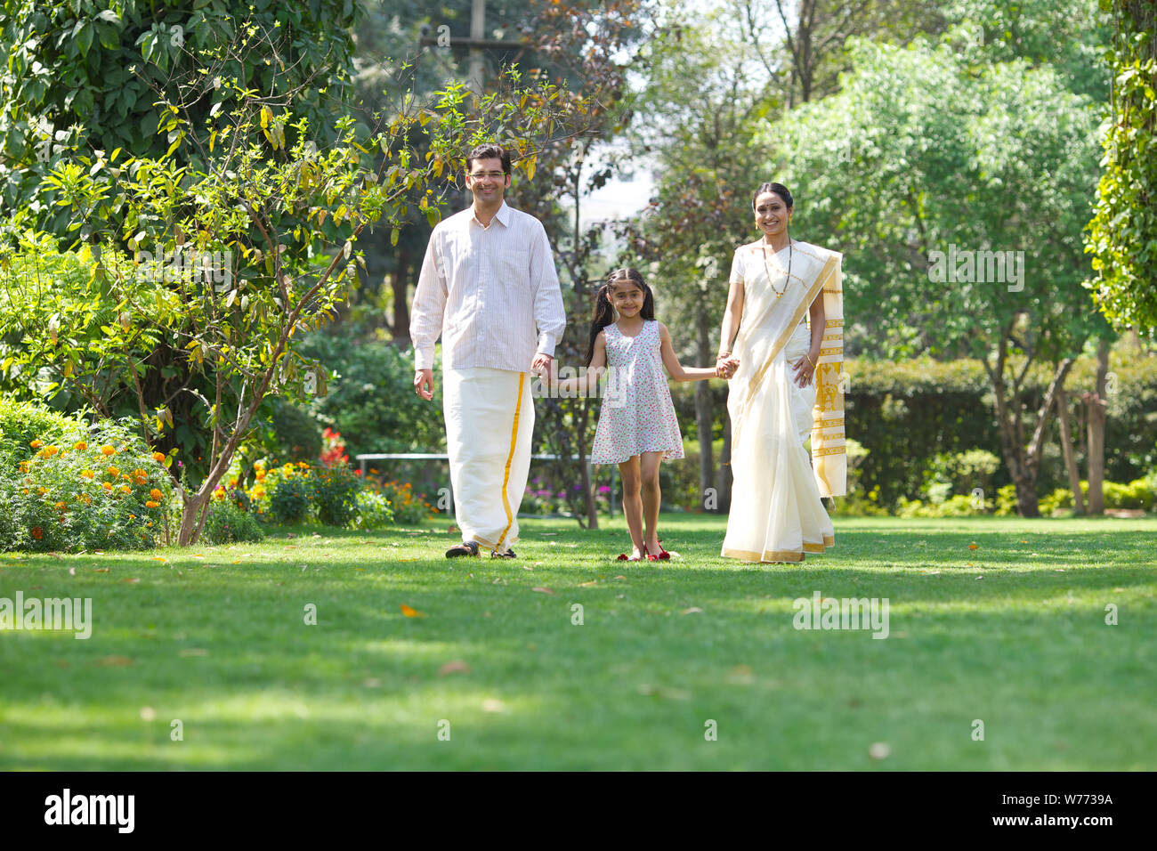 South Indian family walking together in a park Stock Photo - Alamy