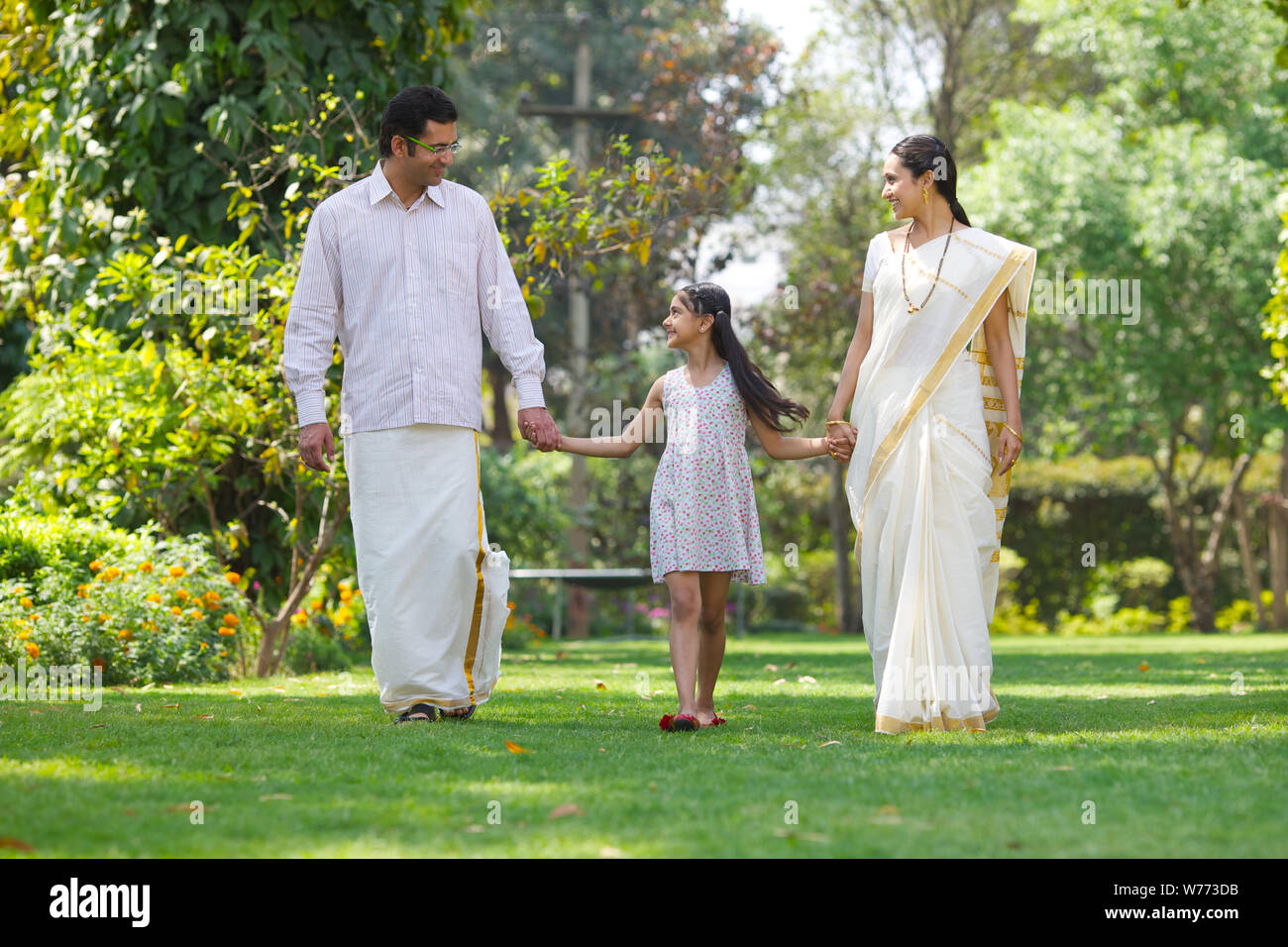 South Indian family walking together in a park Stock Photo - Alamy