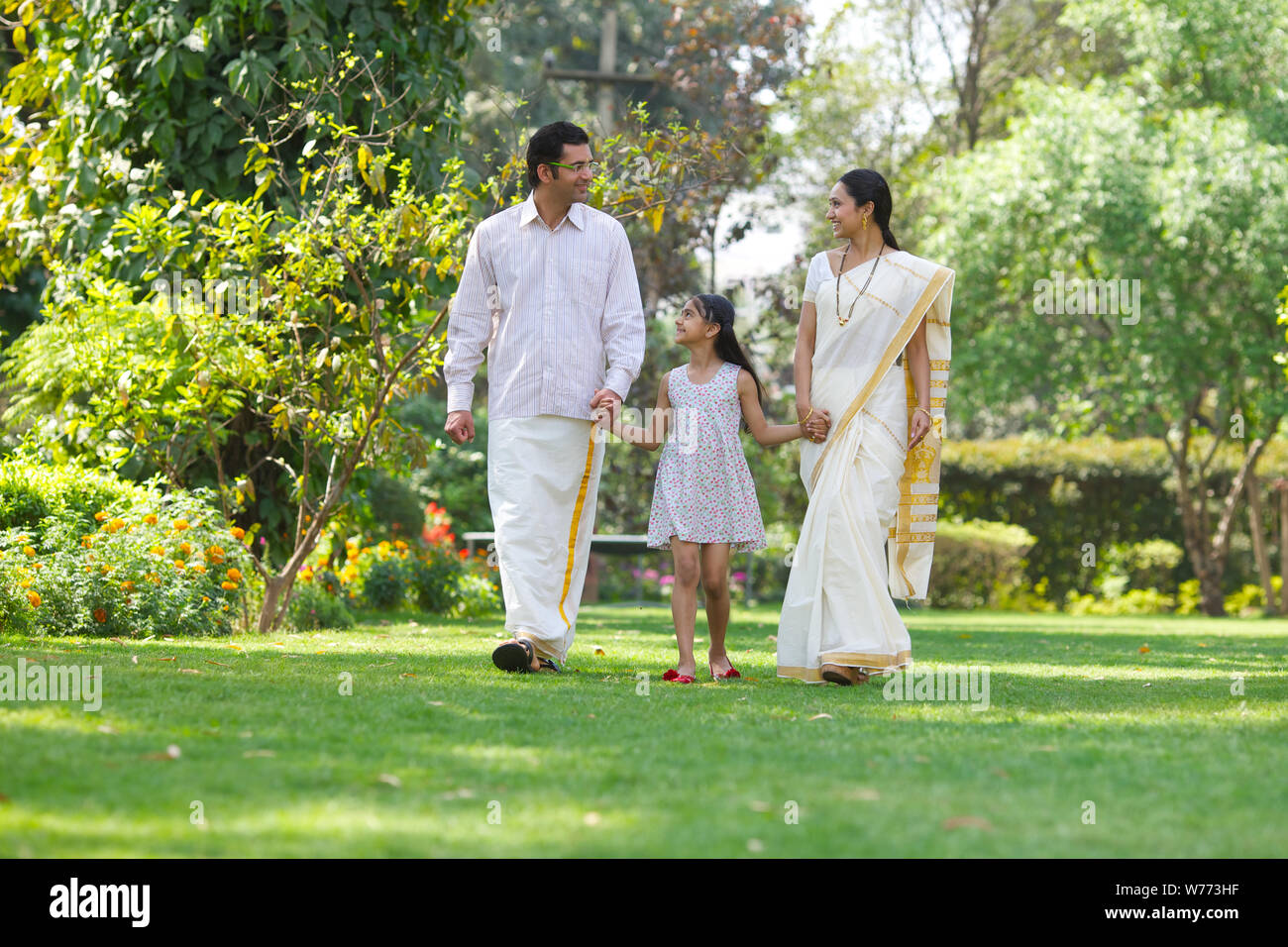 South Indian family walking together in a park Stock Photo - Alamy