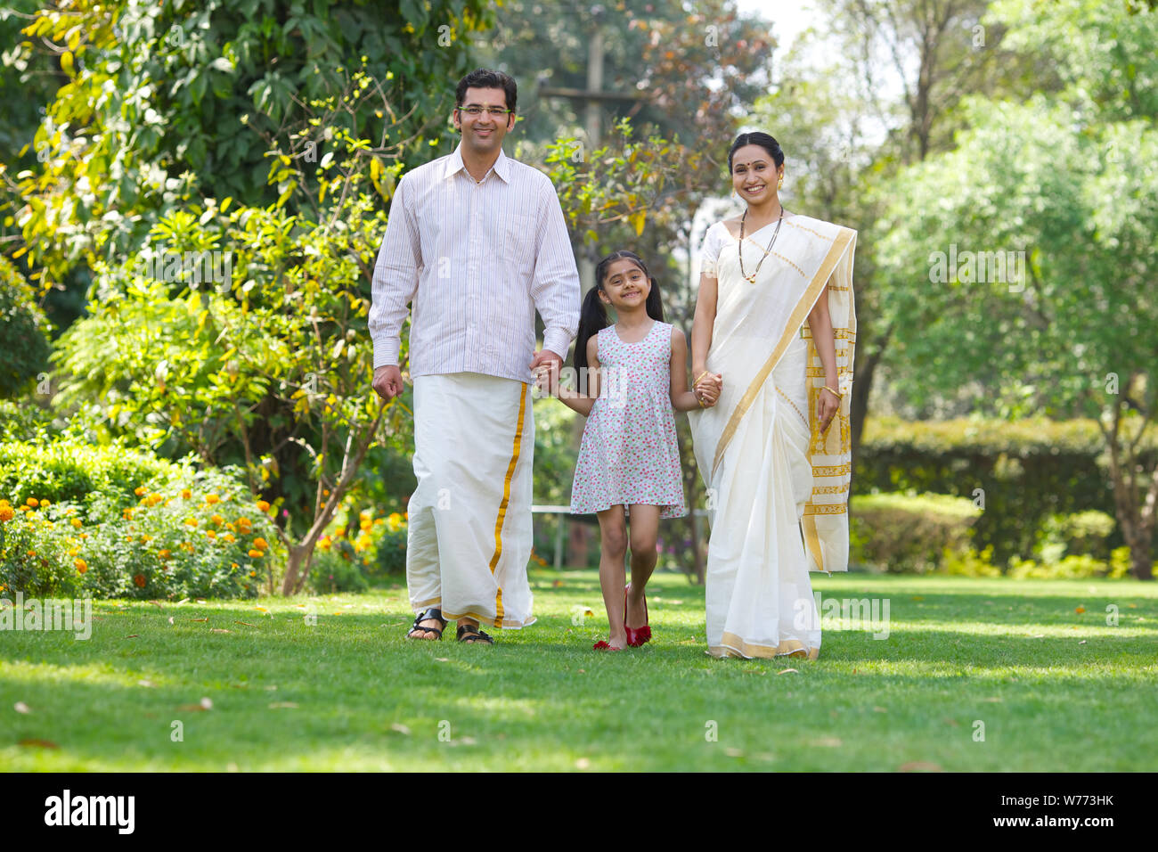 South Indian family walking together in a park Stock Photo - Alamy