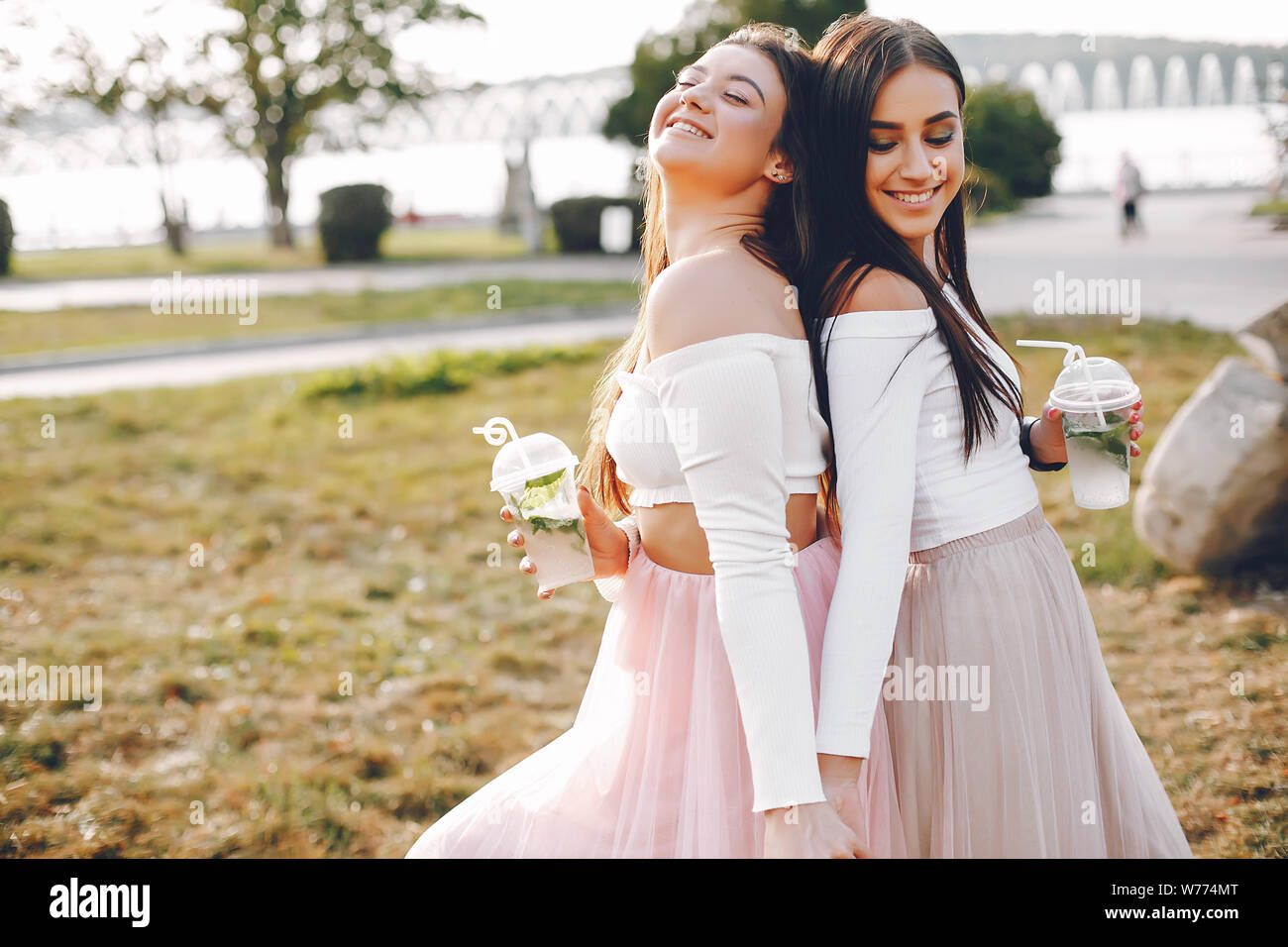Two pretty girls in a summer park Stock Photo - Alamy