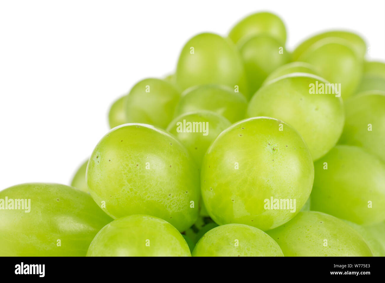 Lot of whole fresh green grape in closeup isolated on white background ...