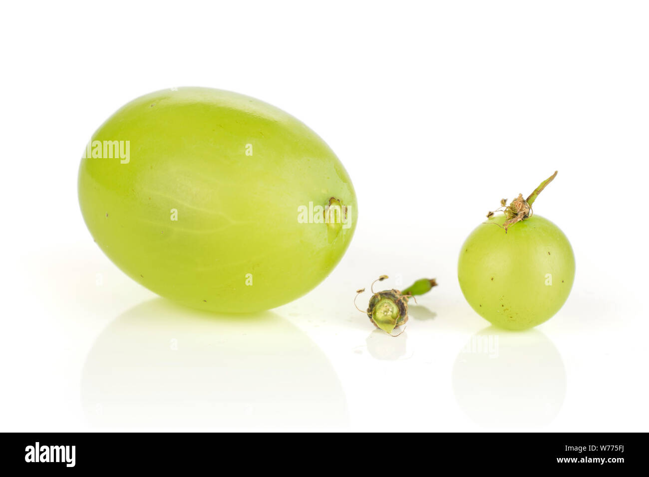 Group of two whole one piece of fresh green grape isolated on white ...