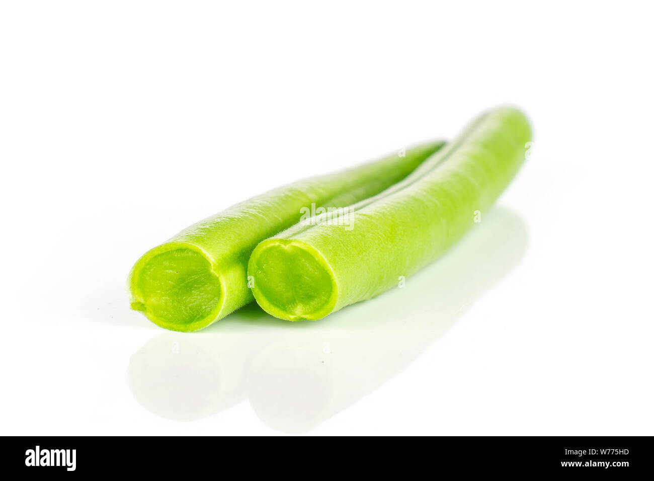 Group of two halves of fresh green bean isolated on white background ...