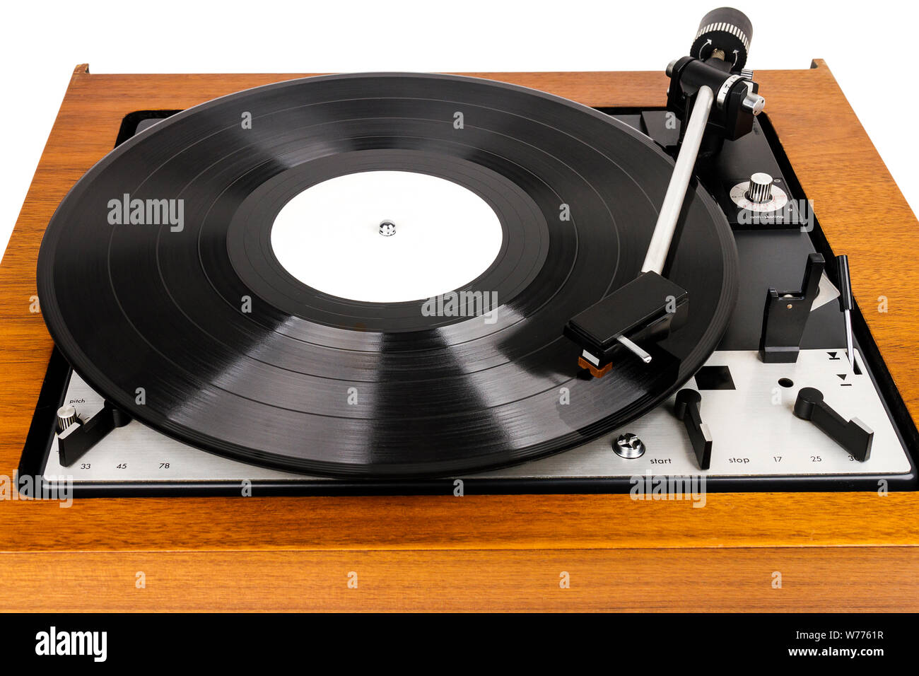 Vintage turntable vinyl record player isolated on white. Wooden plinth ...