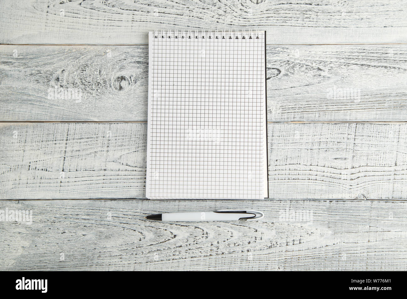 white paper Notepad and white pen on vintage shabby white wooden ...