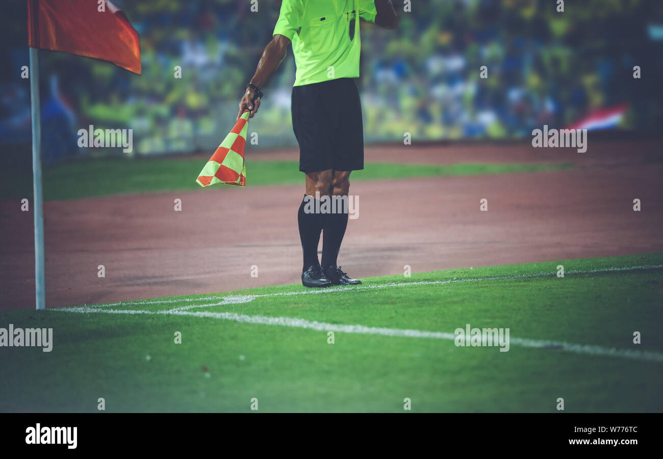 Assistant football referee and Referee flag at football stadium Stock ...