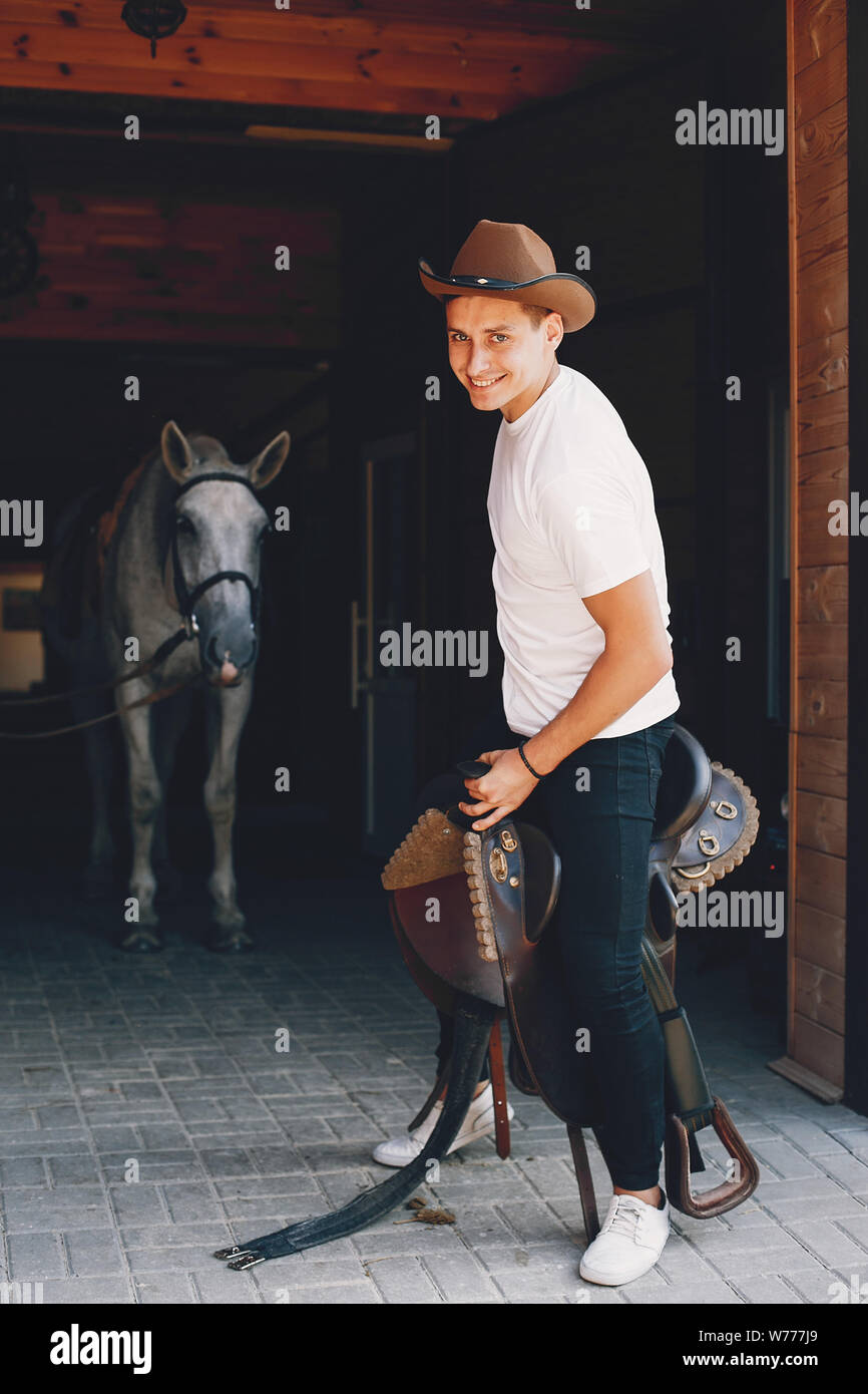 Handsome cowboy riding hi-res stock photography and images - Alamy