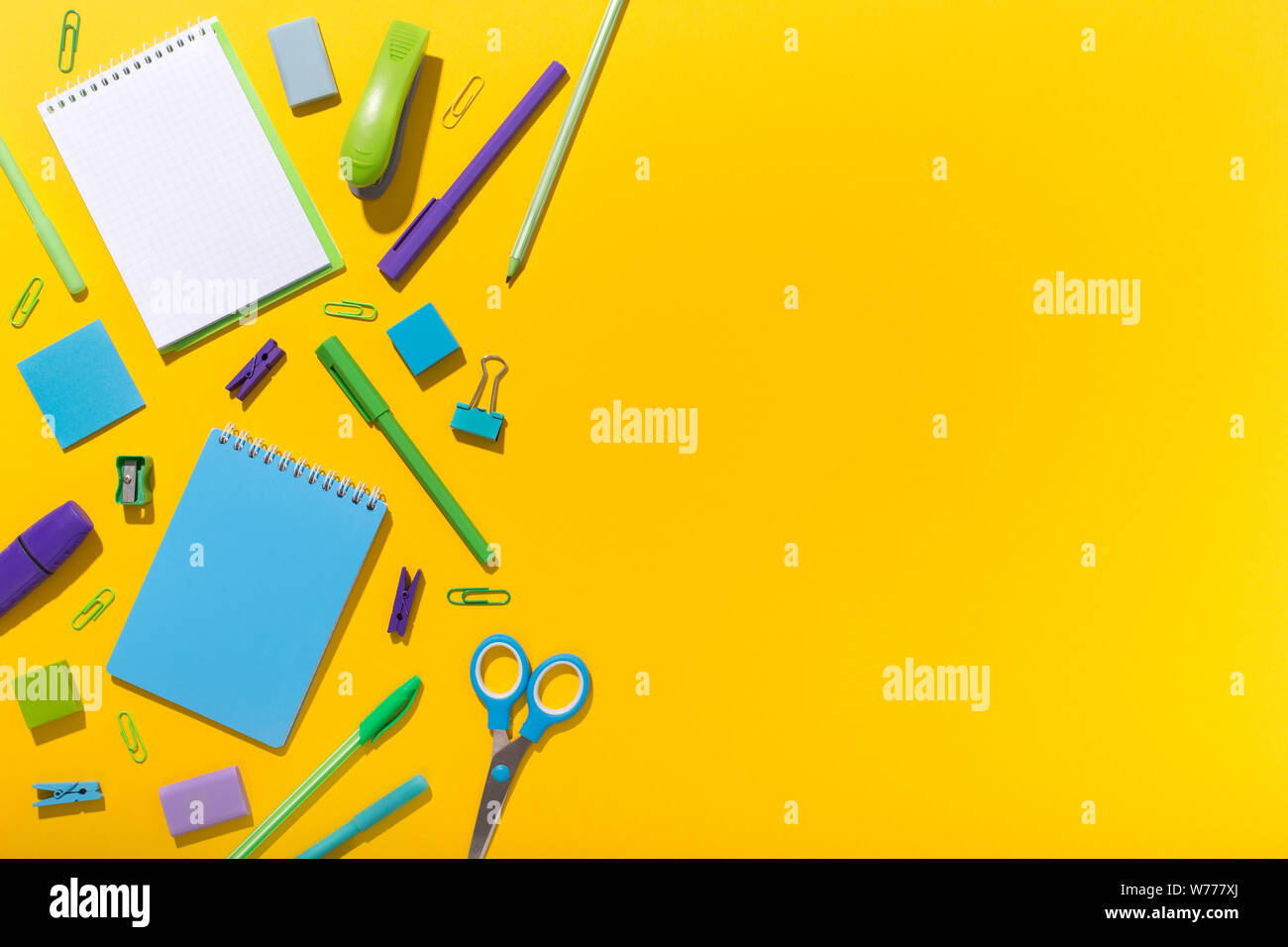 Modern office stationery for sale on yellow background Stock Photo - Alamy