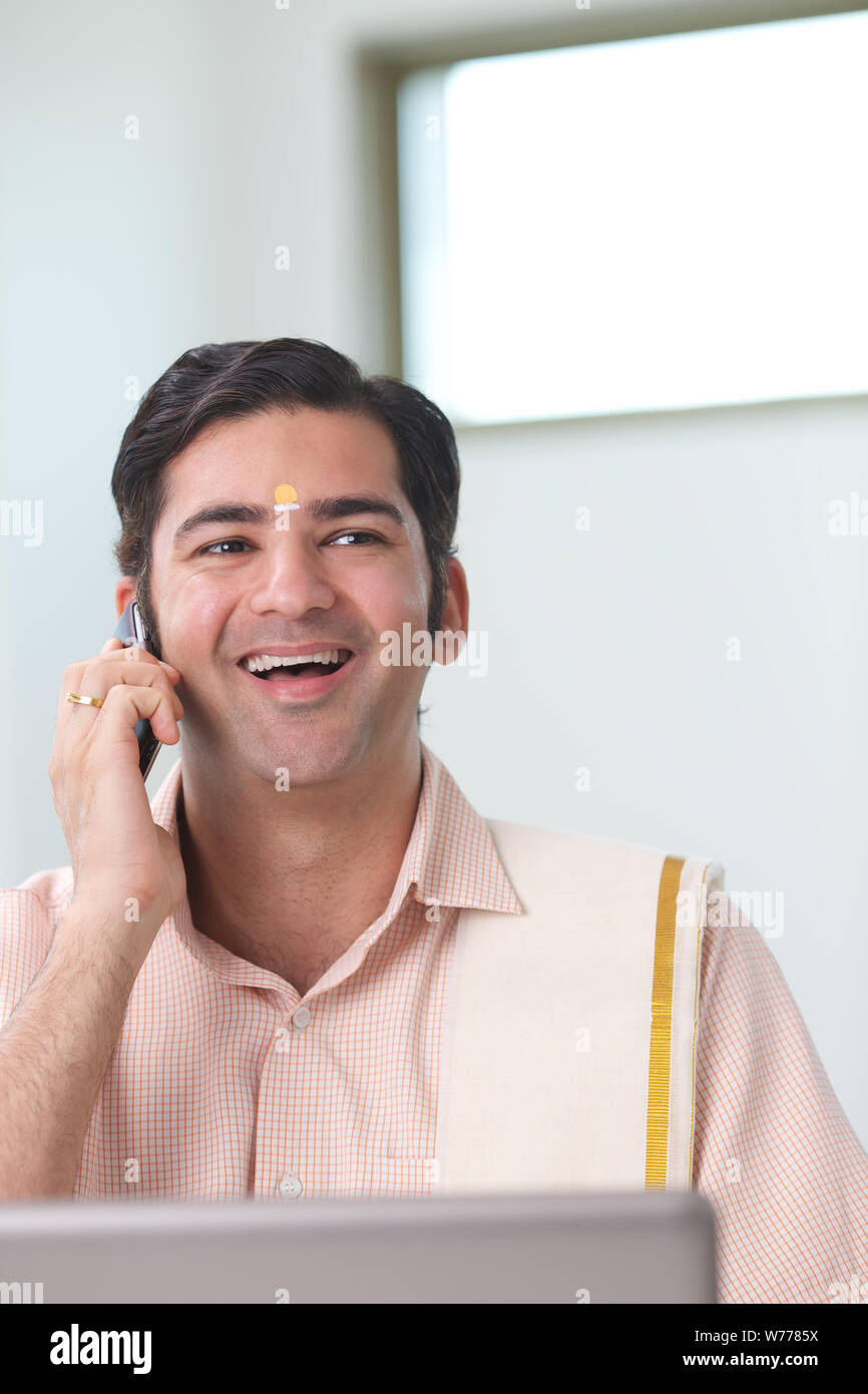 South indian man talking mobile hi-res stock photography and images - Alamy