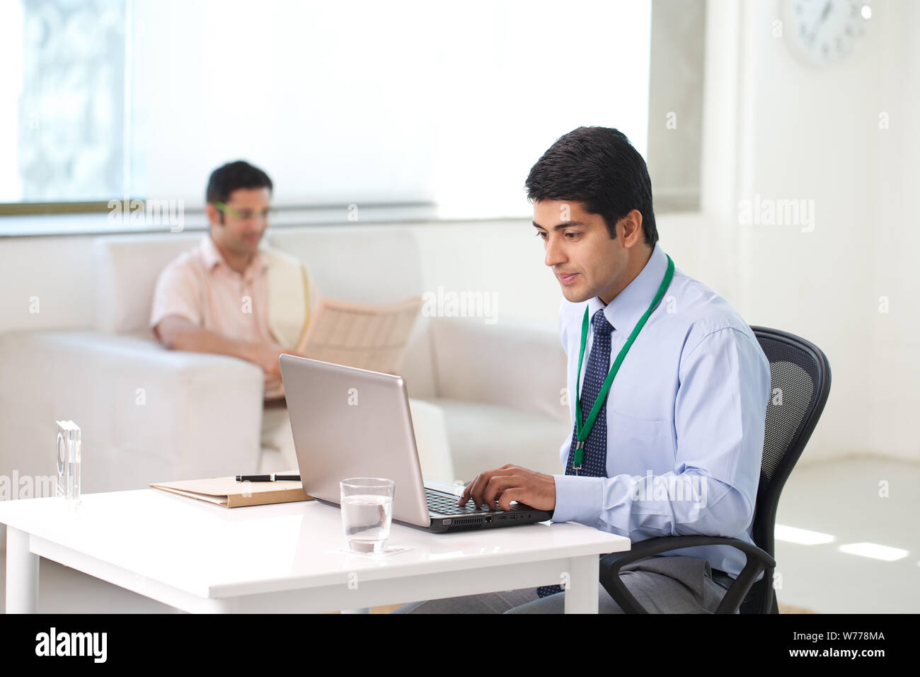 Young banker in front computer hi-res stock photography and images - Alamy