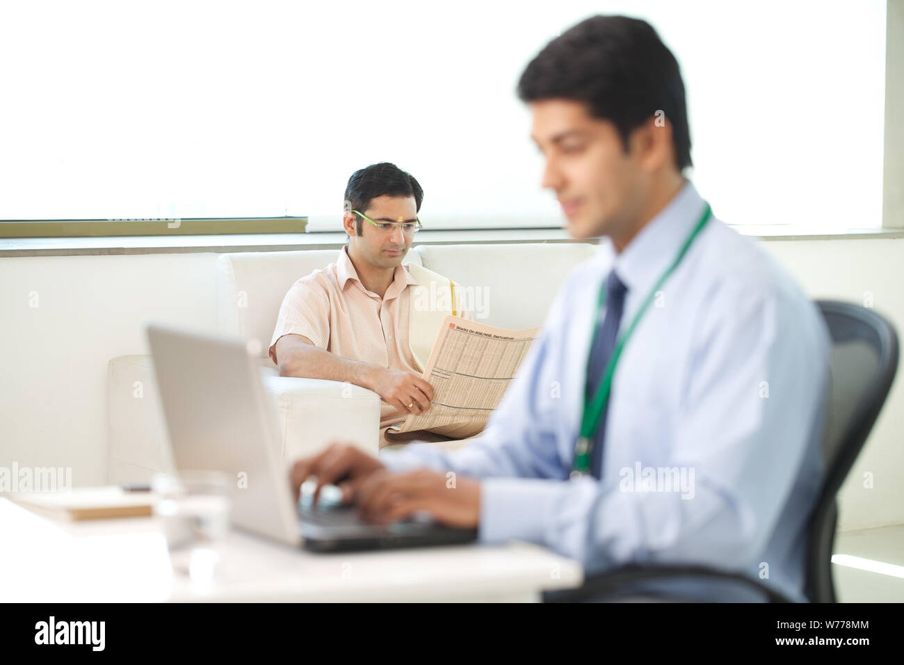 Man reading a newspaper in a bank hi-res stock photography and images ...