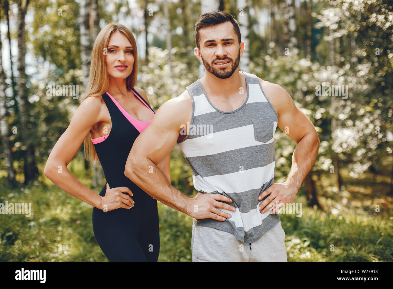 Sports couple in a morning summer park Stock Photo - Alamy