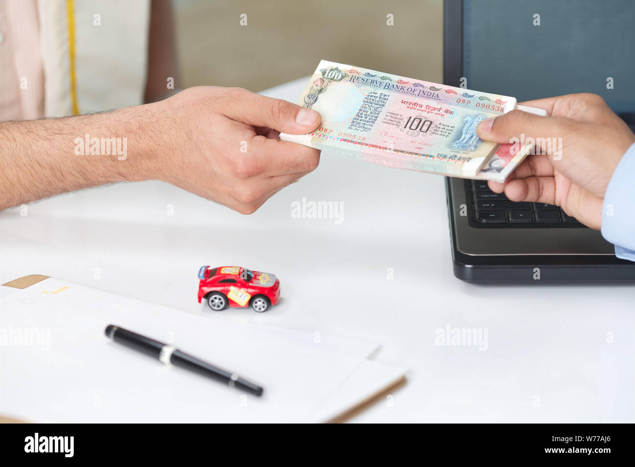 Hand giving cash hand car hi-res stock photography and images - Alamy